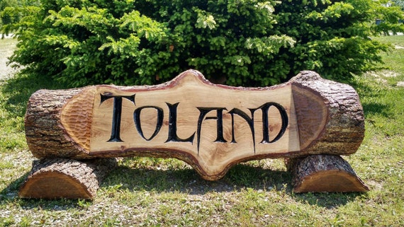 Custom carved name log