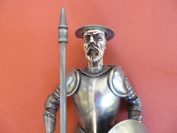 Don Quixote in full armor stands 8 1/2 tall on a wooden
