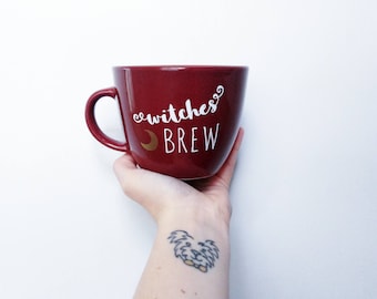 Witches cauldron candle scented in berry bewitching brew