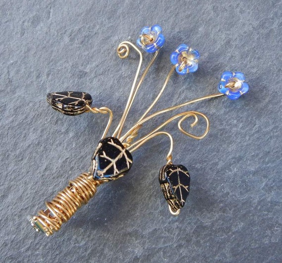 Items similar to Wire Wrapped Floral Bouquet Brooch with Blue Glass ...