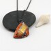 Eruption pieces of lava shield pendant formed and enameled