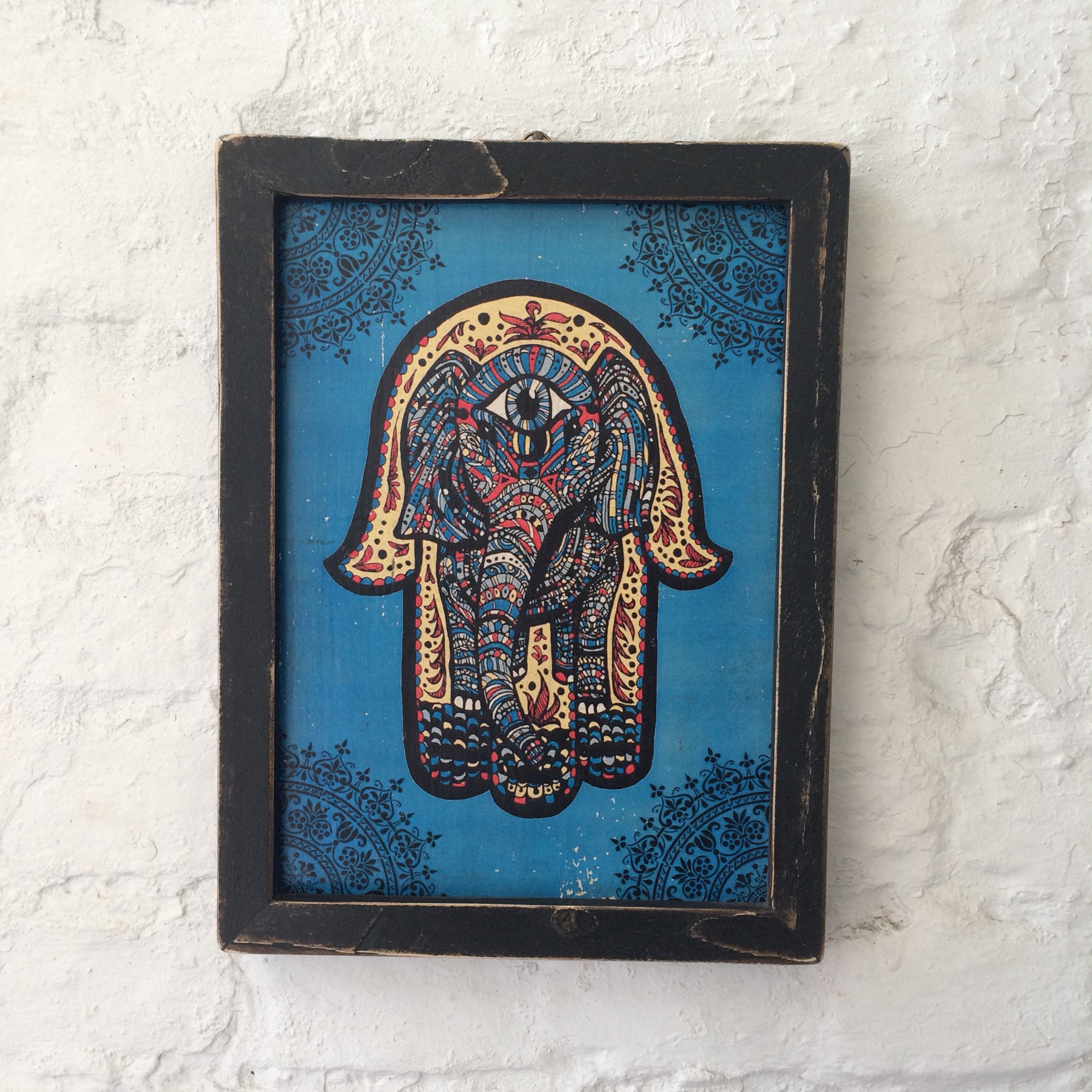 Framed wooden sign with Hand of Fatima