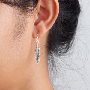 Feather earrings | Etsy