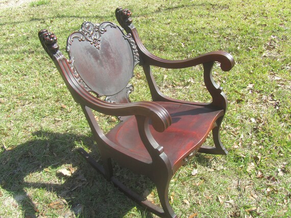 Antique chairAntique lions headGriffin furniturerocking