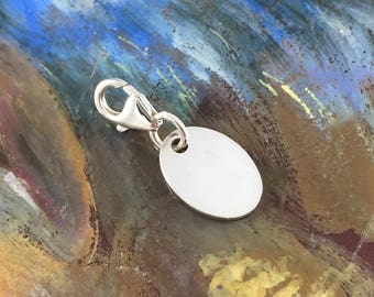 Sterling Silver Oval Disc with Heart cut outone pairor long