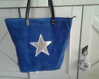 Black leather bag with silver metallic flap