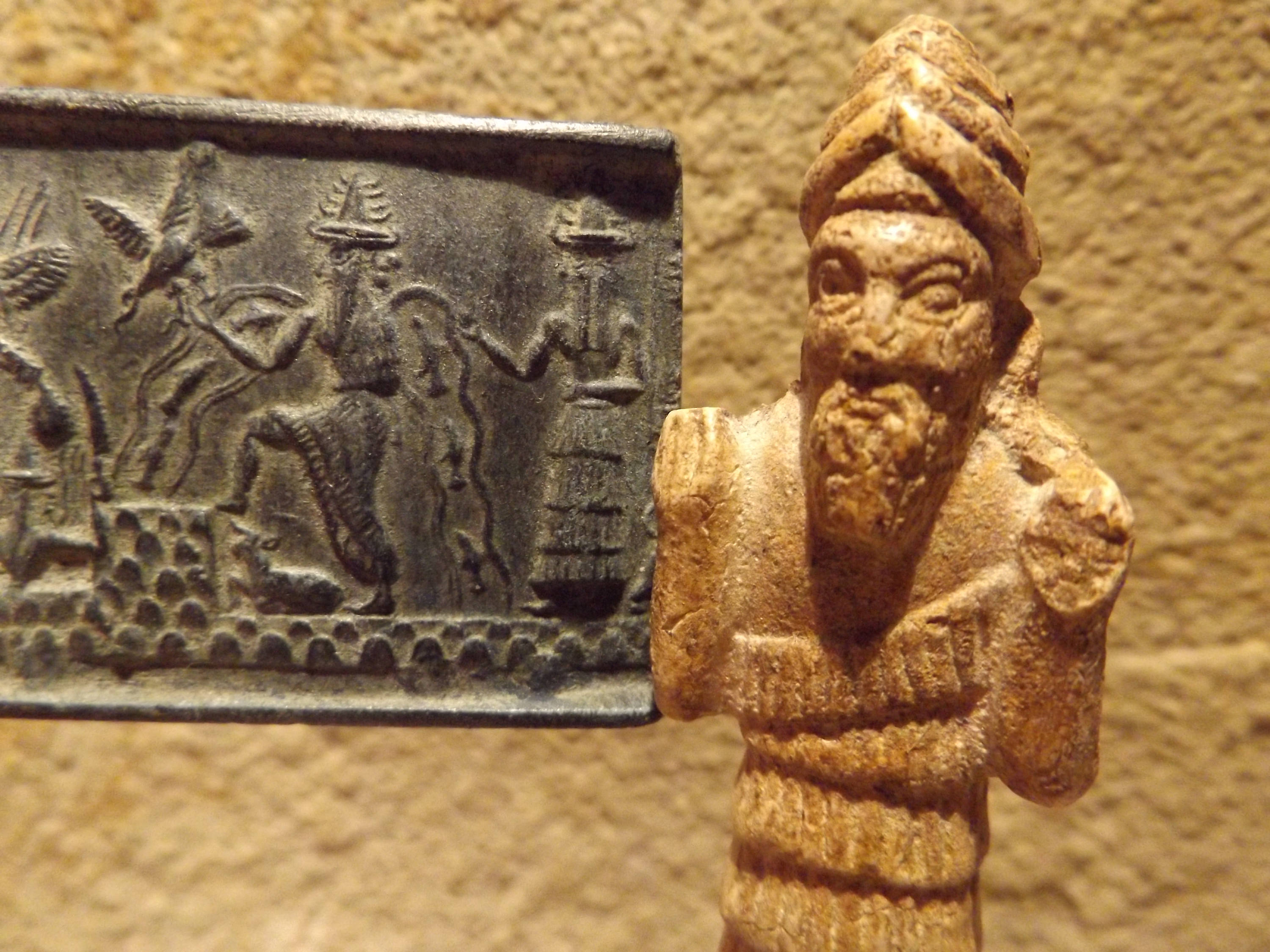 Sumerian statue and seal impression replica. Enki Ishtar