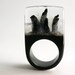 Zombie creepy undead ring with three black hands and fog on